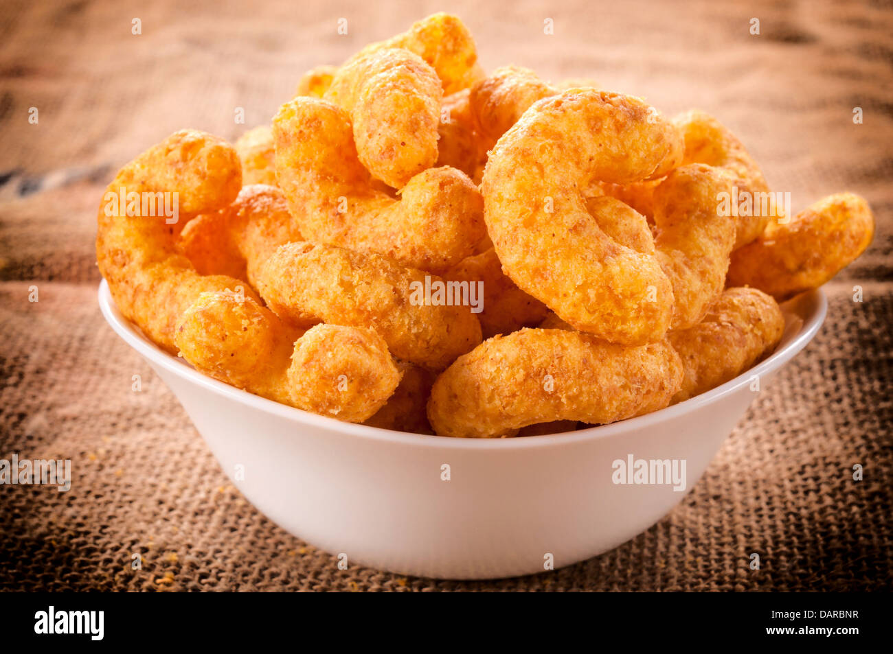 Puffed cheese snacks hi-res stock photography and images - Alamy