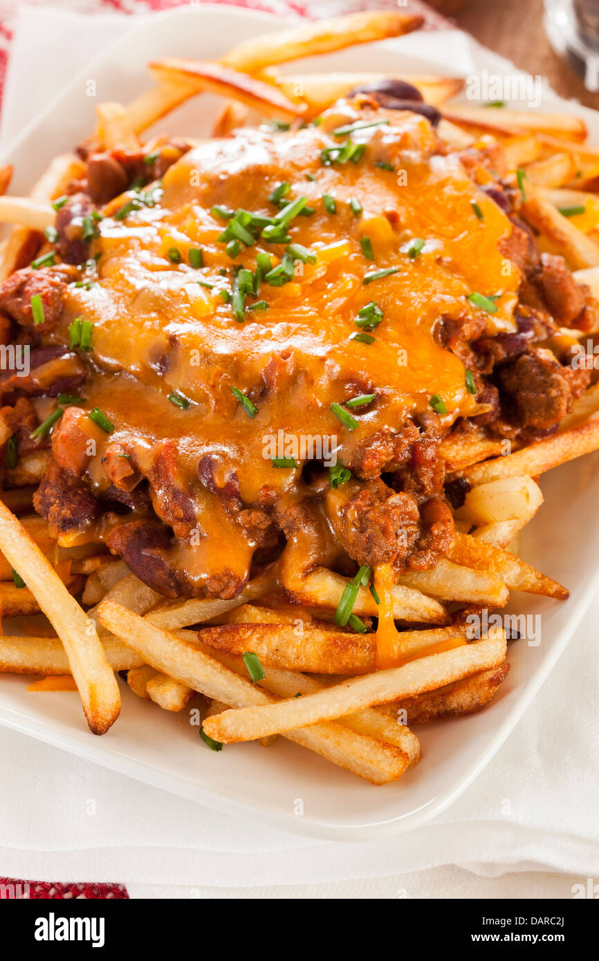 Unhealthy Messy Chili Cheese Fries on a Background Stock Photo - Alamy