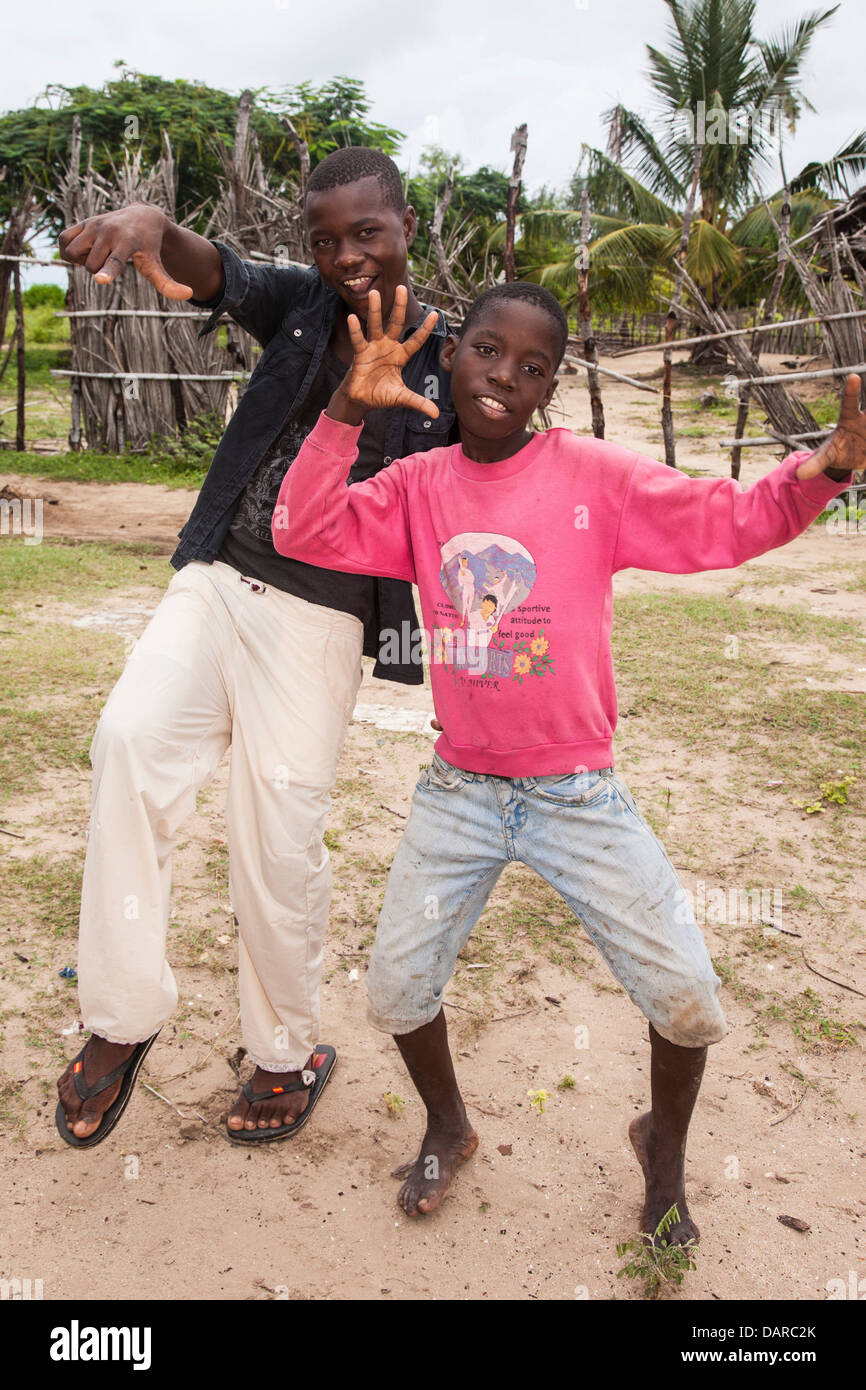 Africa, Mozambique, Quirimba Island. Teenage boys making signs for the camera Stock Photo - Alamy