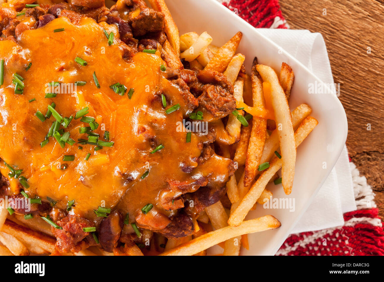 Unhealthy Messy Chili Cheese Fries on a Background Stock Photo - Alamy