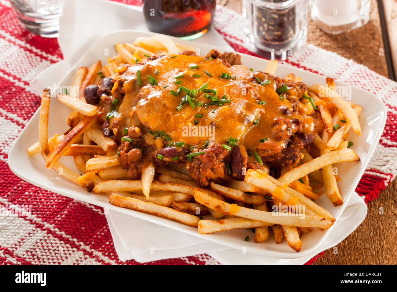 Unhealthy Messy Chili Cheese Fries on a Background Stock Photo - Alamy
