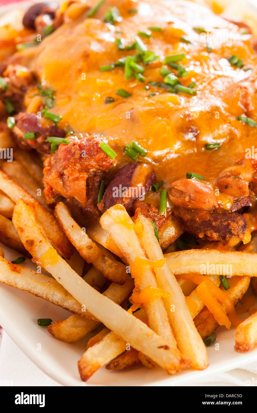 Unhealthy Messy Chili Cheese Fries on a Background Stock Photo - Alamy