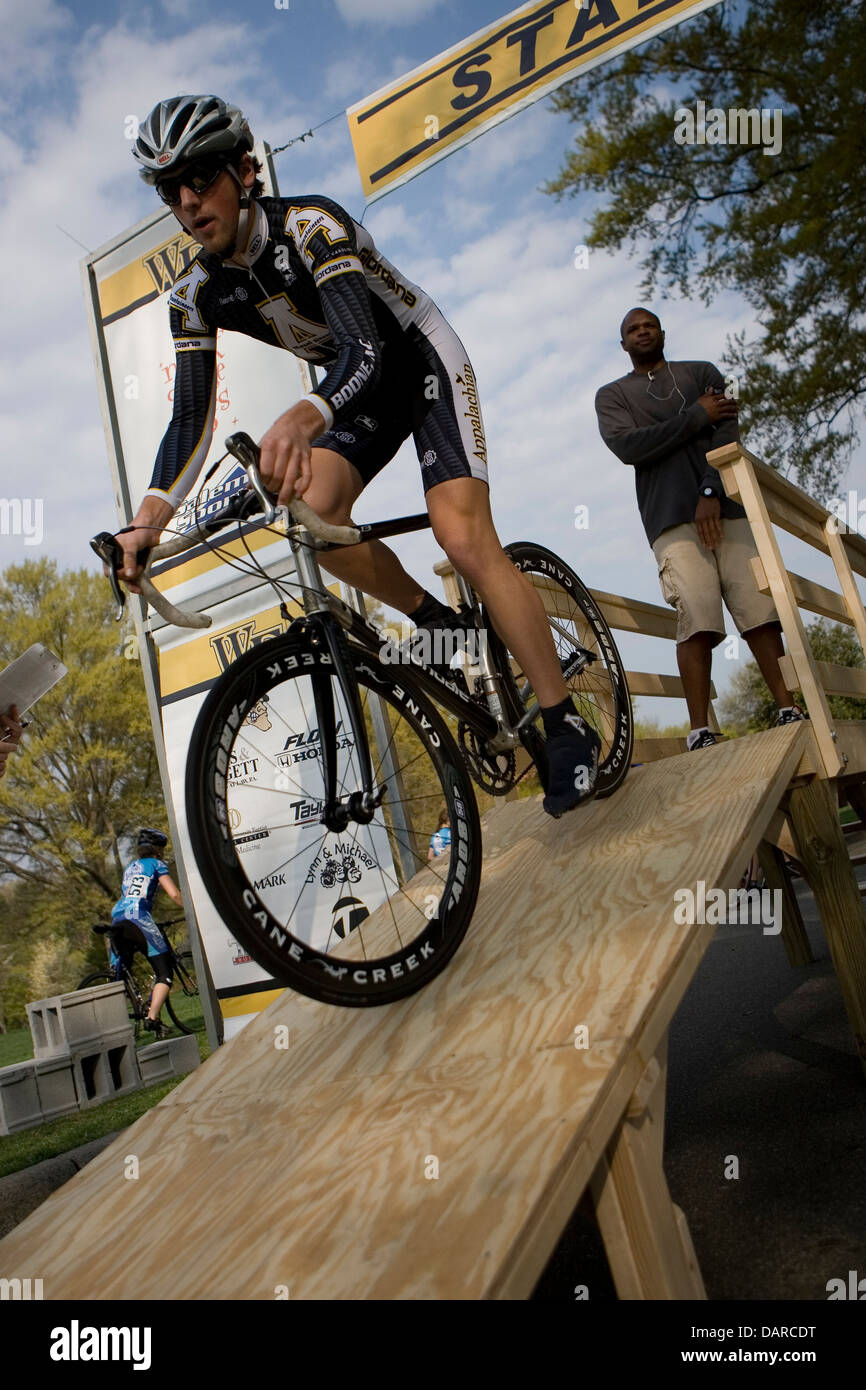 A male cyclist rides down a start ramp during an individual time trial ...