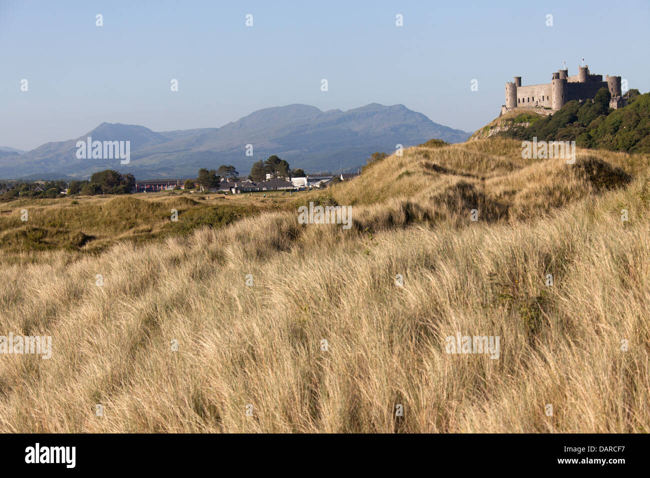Town of Harlech, Wales. The sand dunes of Harlech beach with Harlech ...