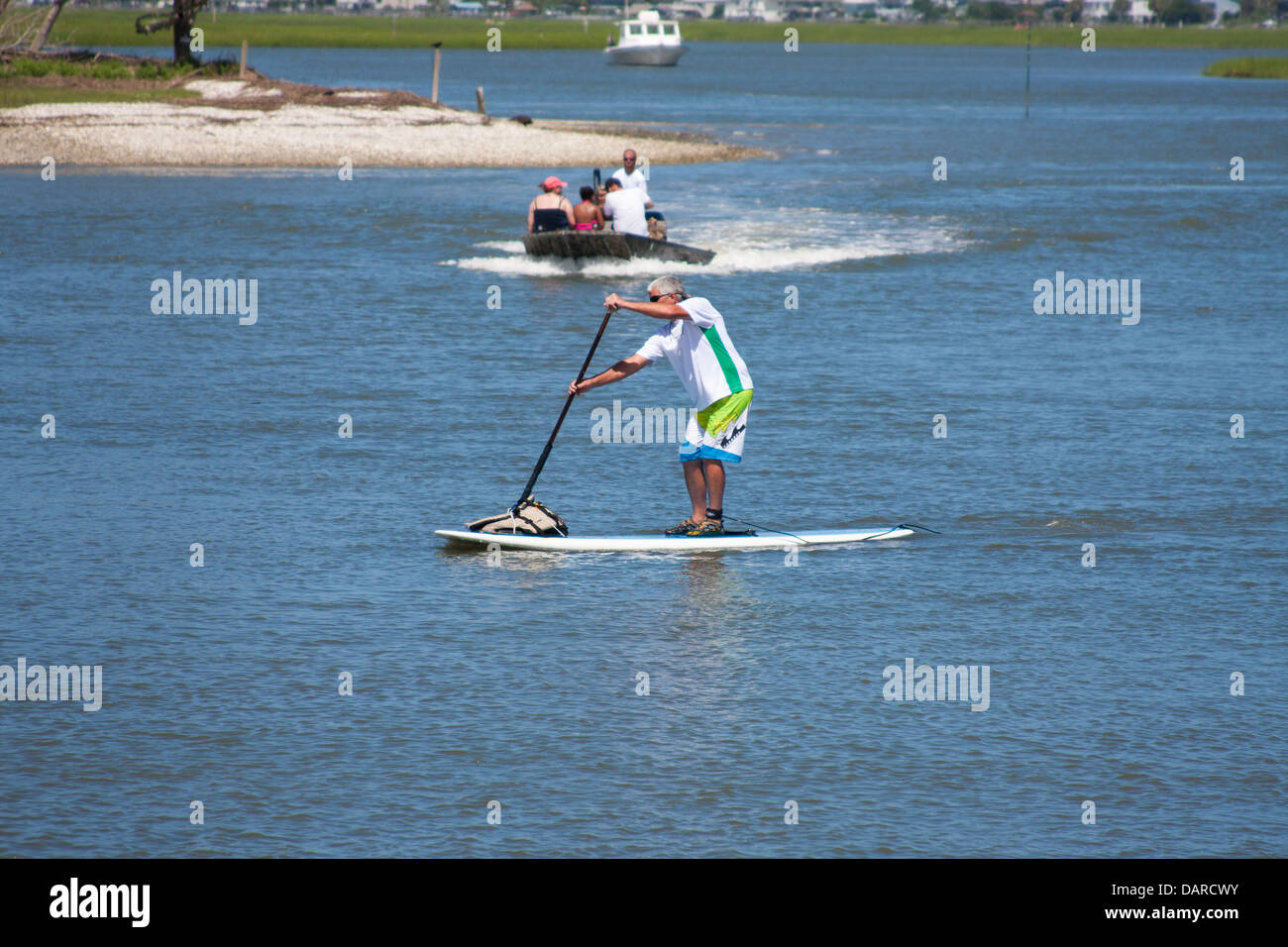 Paddle Boarding On The Ocean Stock Photo - Alamy