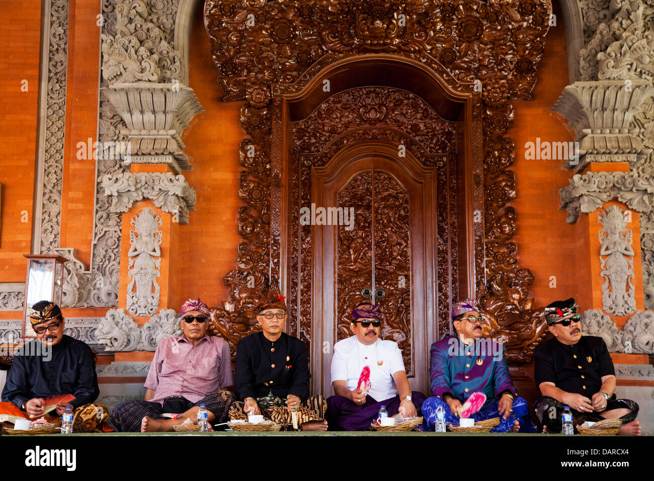 Men sit around at Balinese high class wedding Stock Photo - Alamy