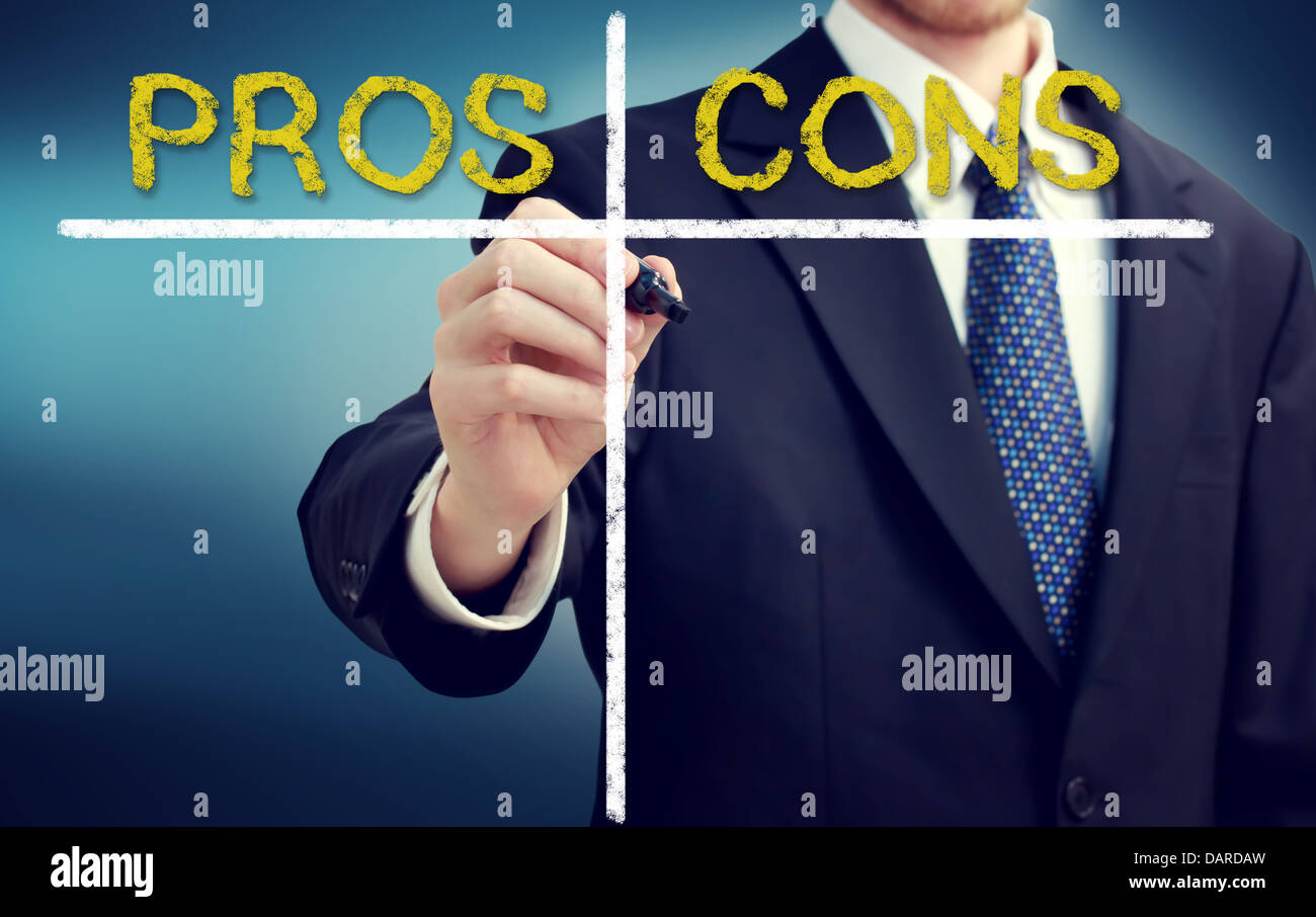Business man writing pros and cons with a navy blue background Stock ...