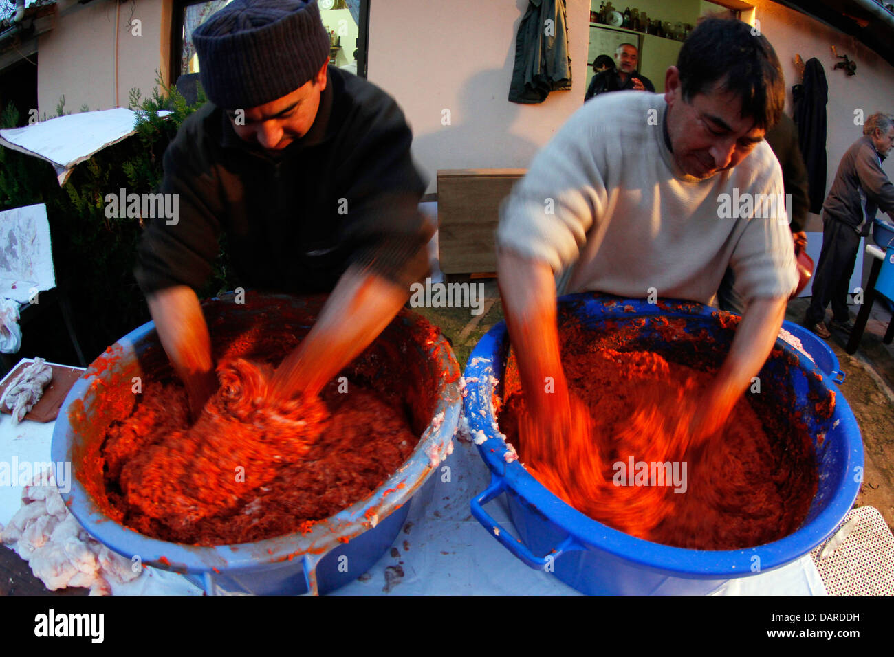 Different scenes from a traditional slaughter day in a village in the ...