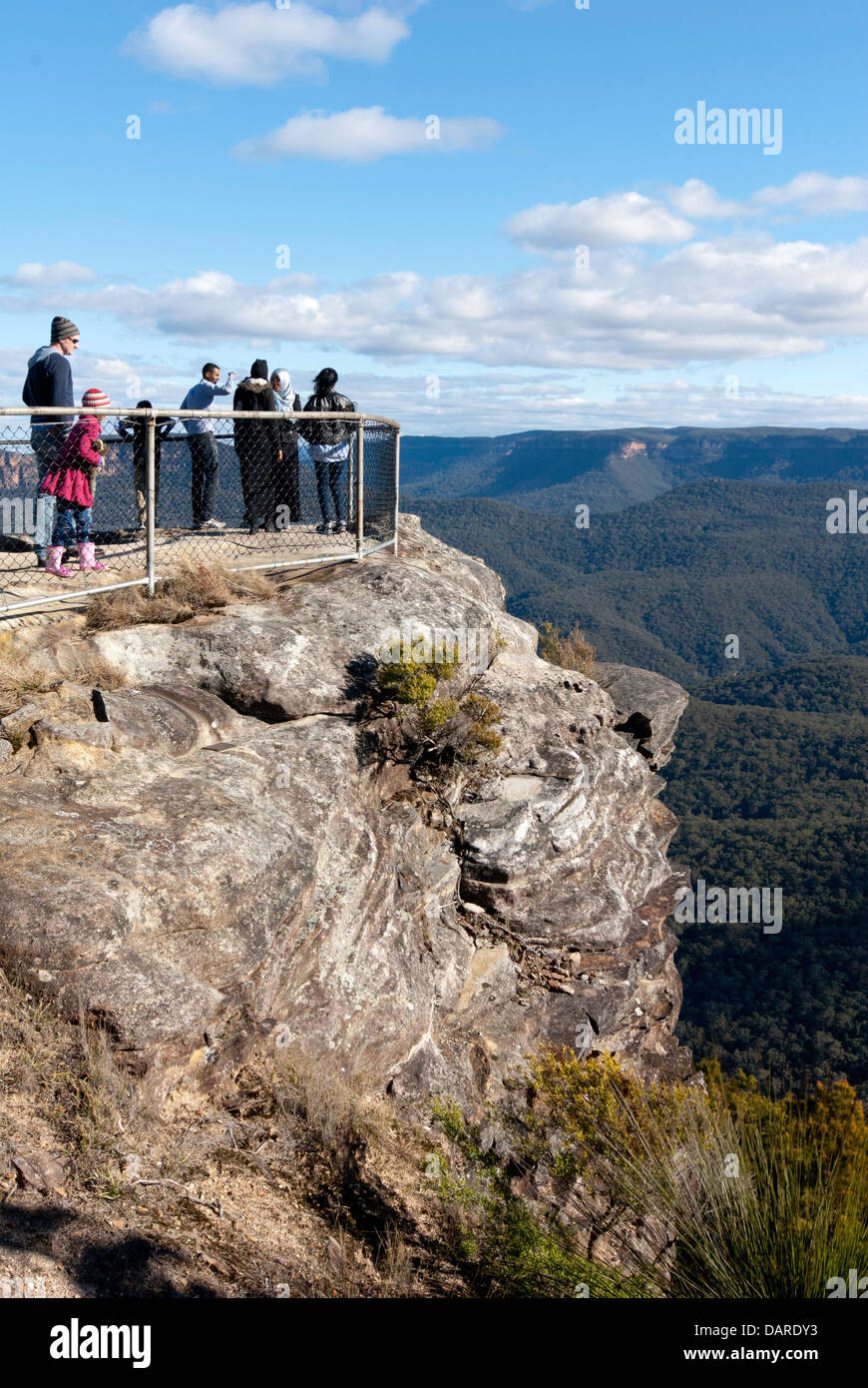People on the viewing lookout rock, looking over the Jamison Valley, at ...