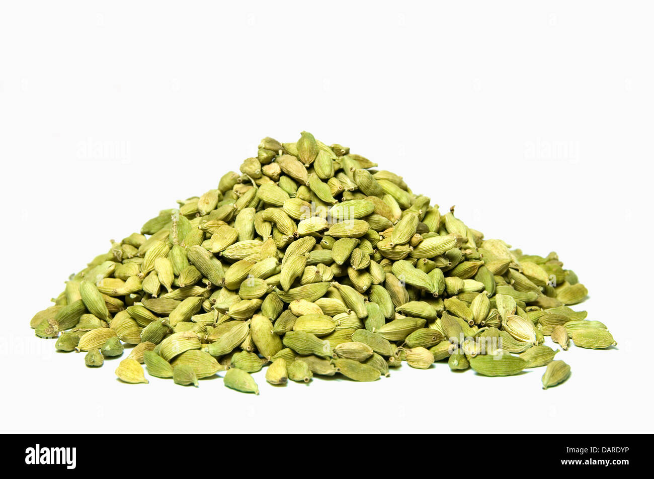 Cardamom seeds isolated on white background Stock Photo - Alamy