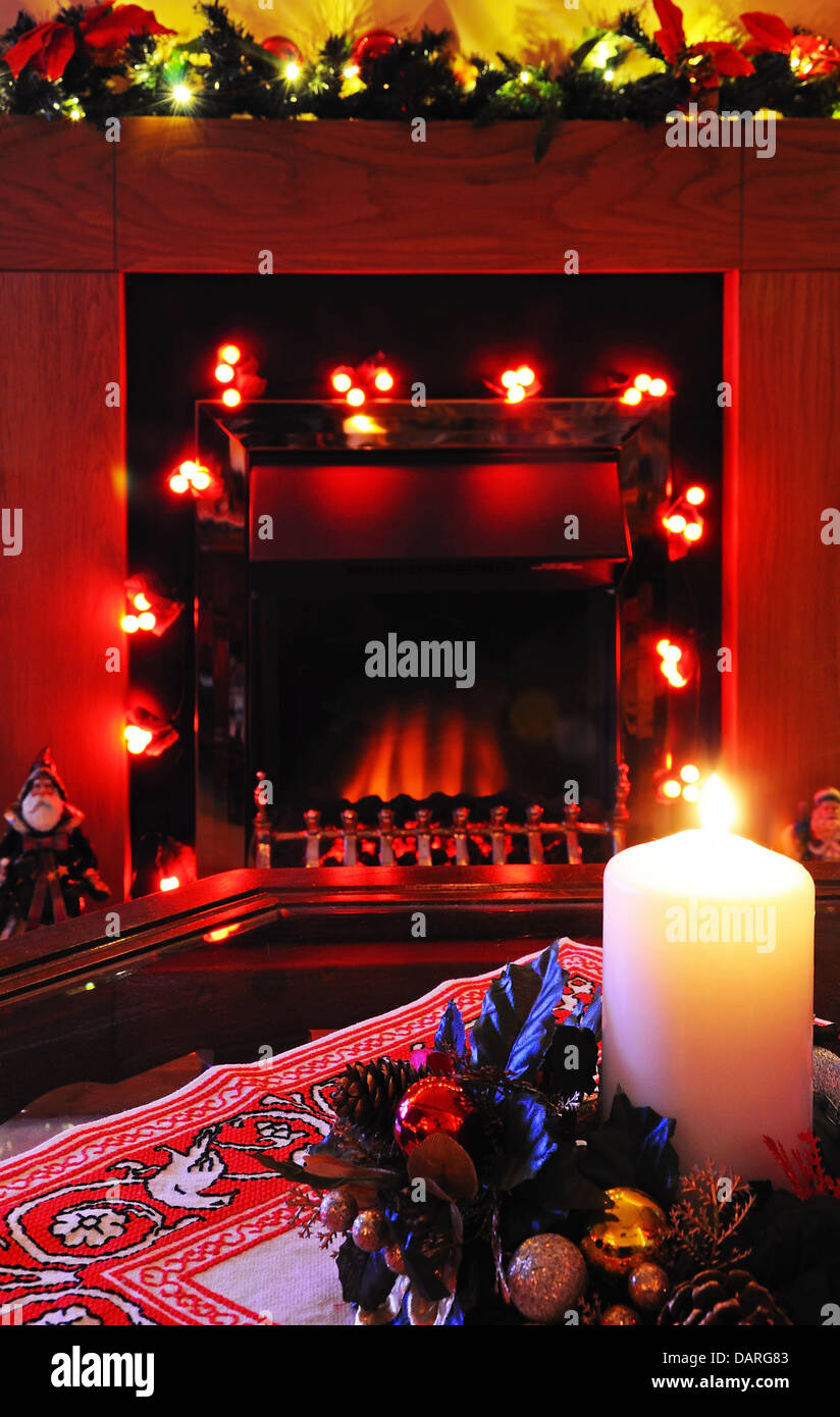 Coal effect electric fire with Christmas decorations Stock Photo - Alamy
