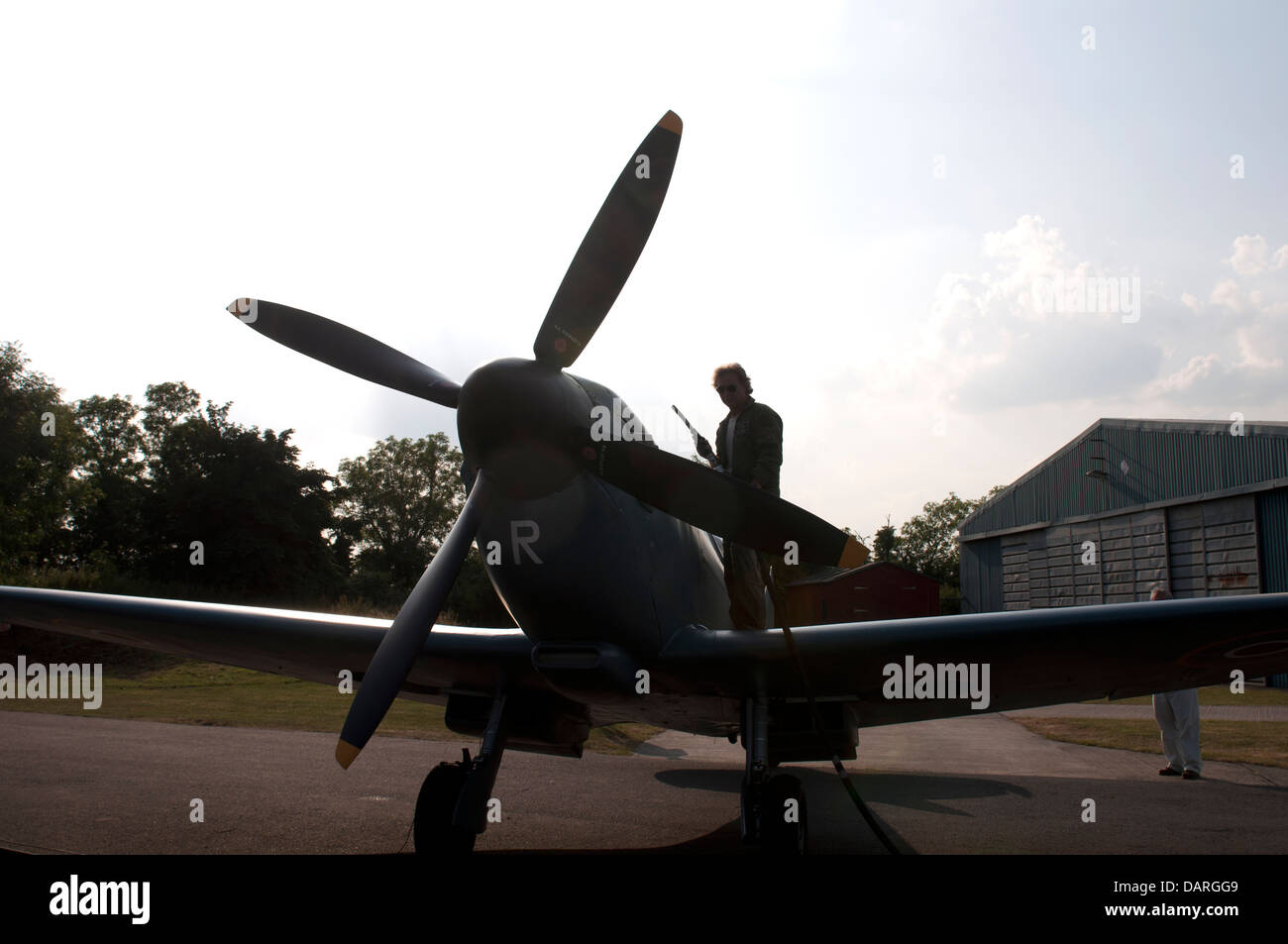 Pilot Peter Teichman refuelling Spitfire Mk XI aircraft at Wellesbourne ...