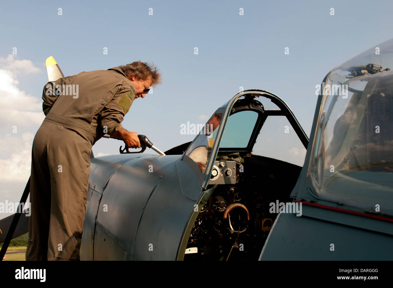 Pilot Peter Teichman refuelling Spitfire Mk XI aircraft at Wellesbourne ...