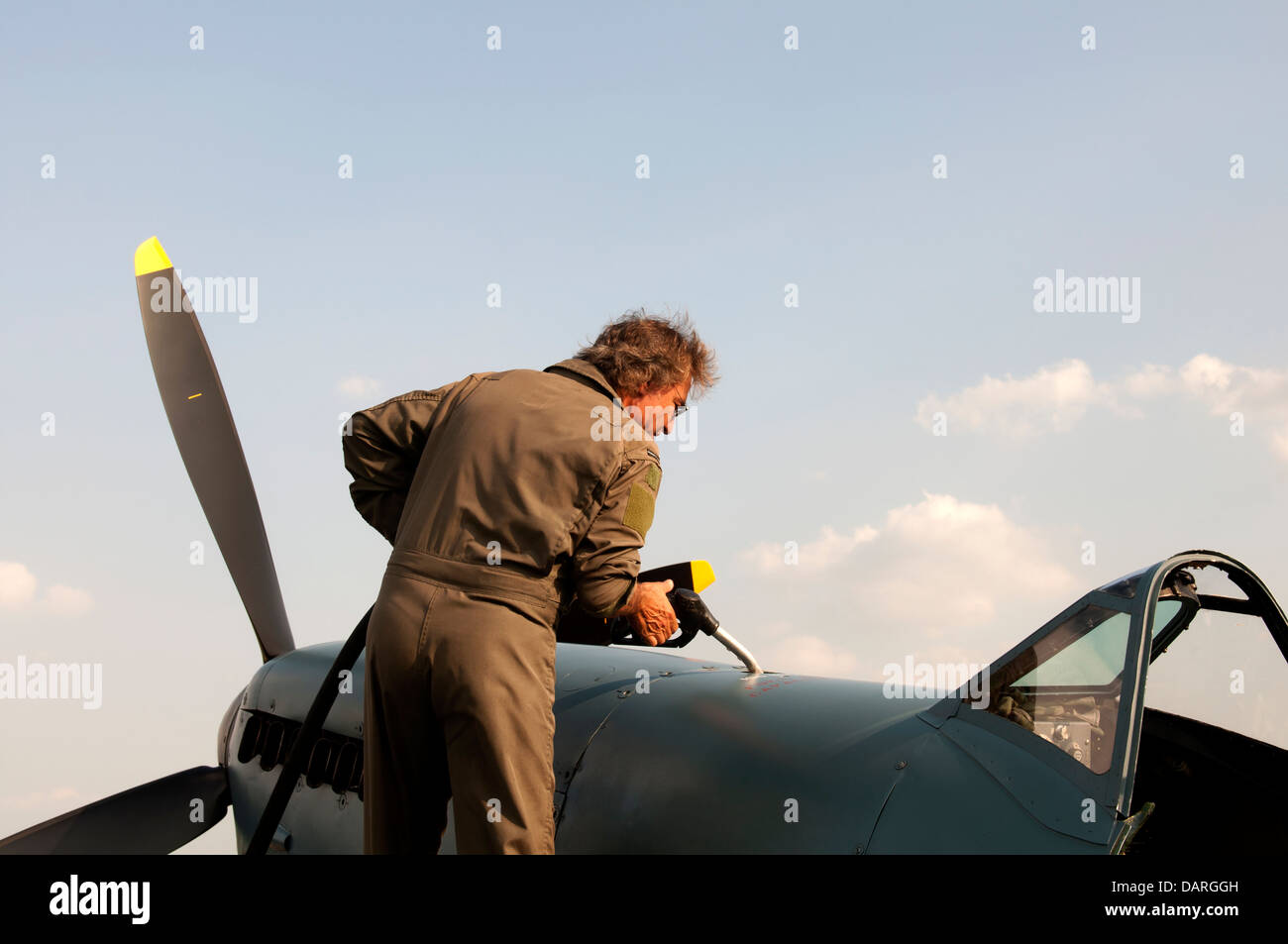Pilot Peter Teichman refuelling Spitfire Mk XI aircraft at Wellesbourne ...