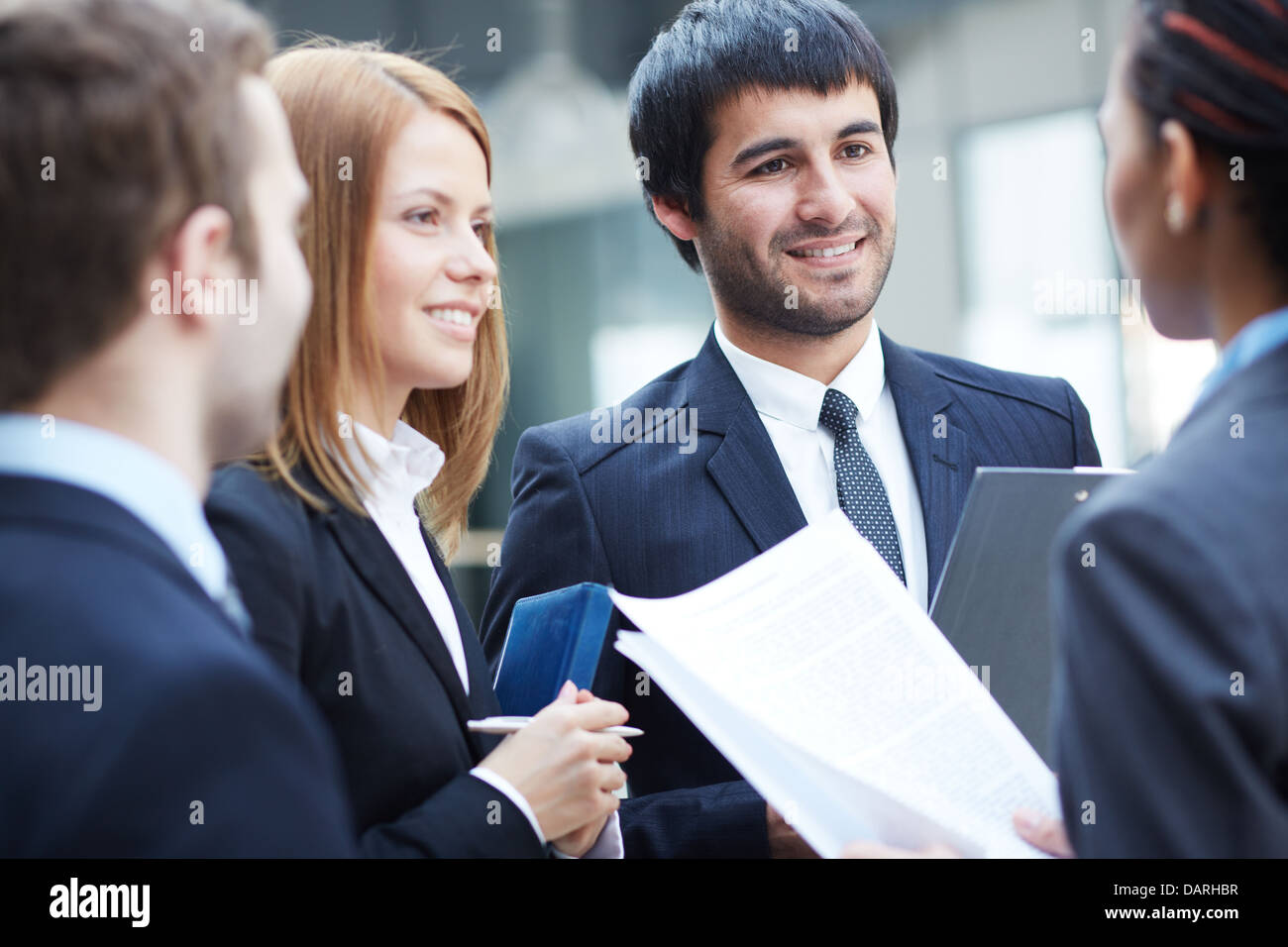 Group of business partners negotiating at meeting Stock Photo - Alamy