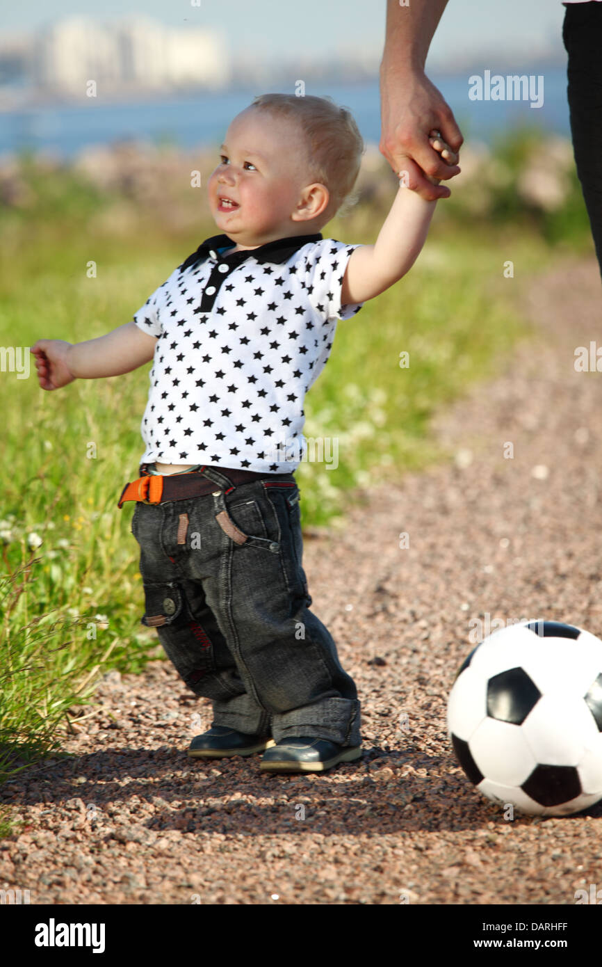 little boy play soccer outdoor Stock Photo - Alamy
