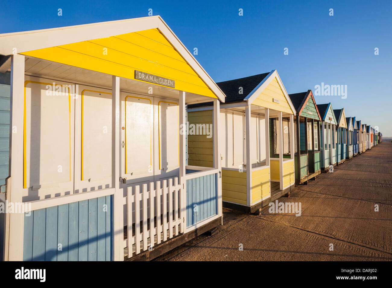 Brightly painted beach huts southwold hi-res stock photography and ...