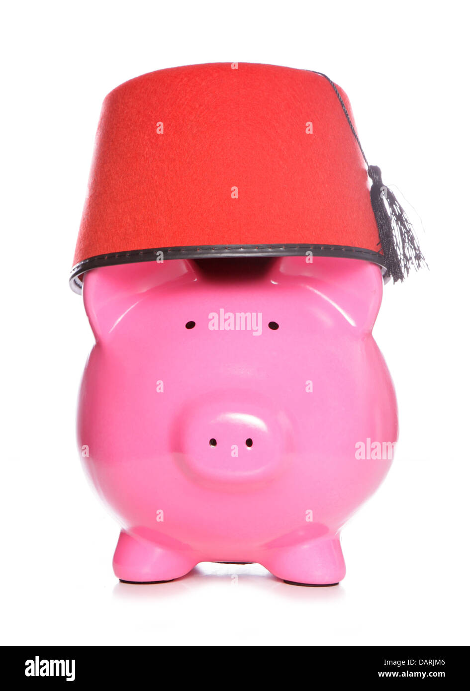Piggy bank wearing a fez hat studio cutout Stock Photo - Alamy