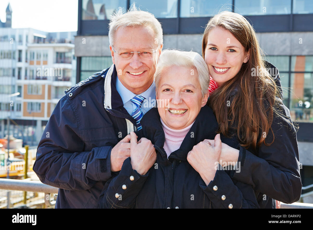 Happy senior family outdoors in a city Stock Photo - Alamy
