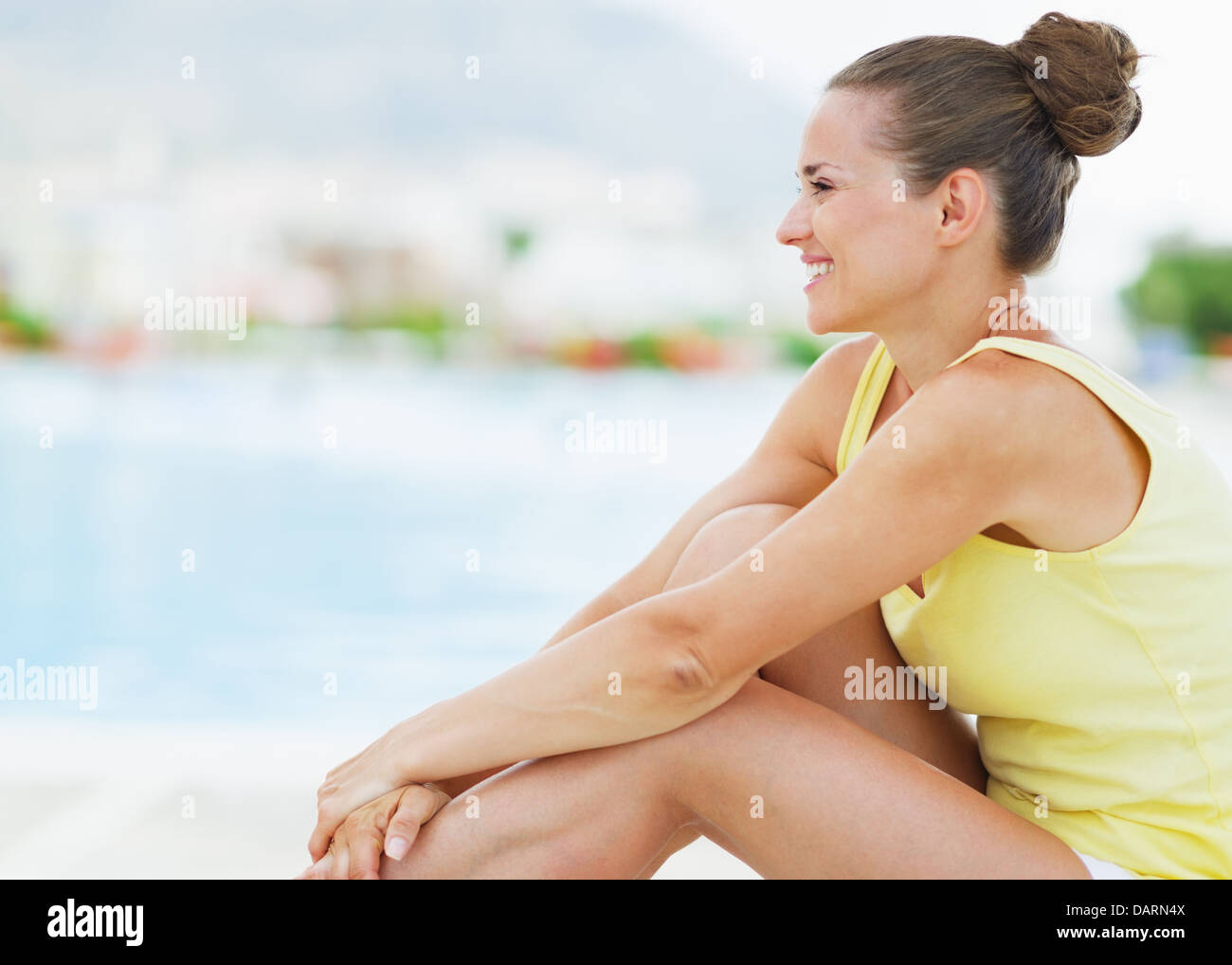 Beautiful woman sitting on sunbed hi-res stock photography and images ...