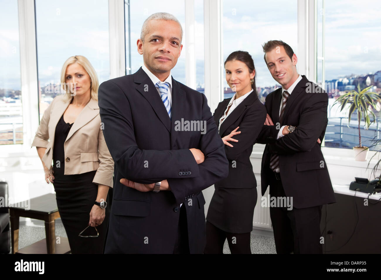 Businessman standing in front Stock Photo - Alamy