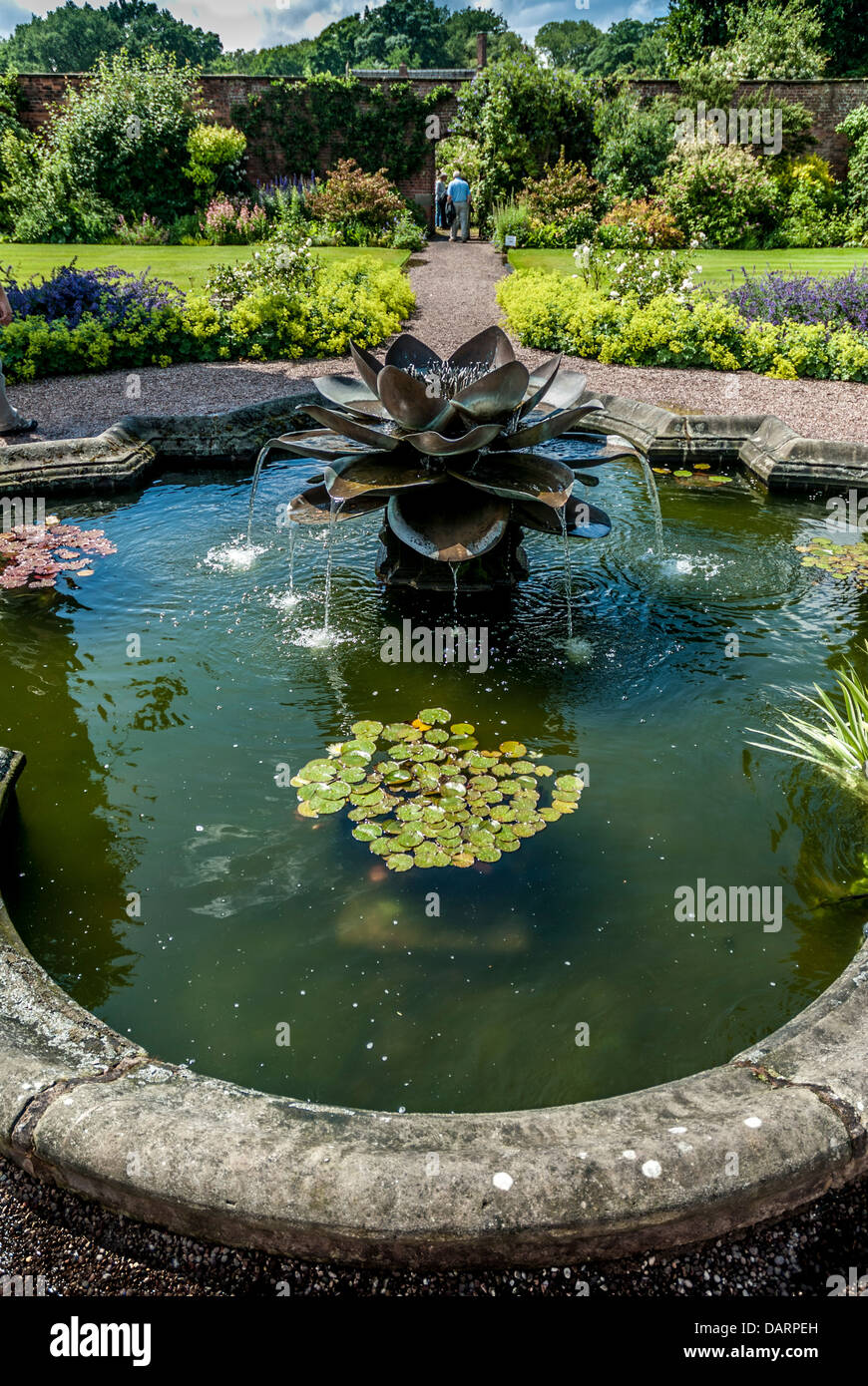 Ornate floral style water feature at a formal large garden Stock Photo ...