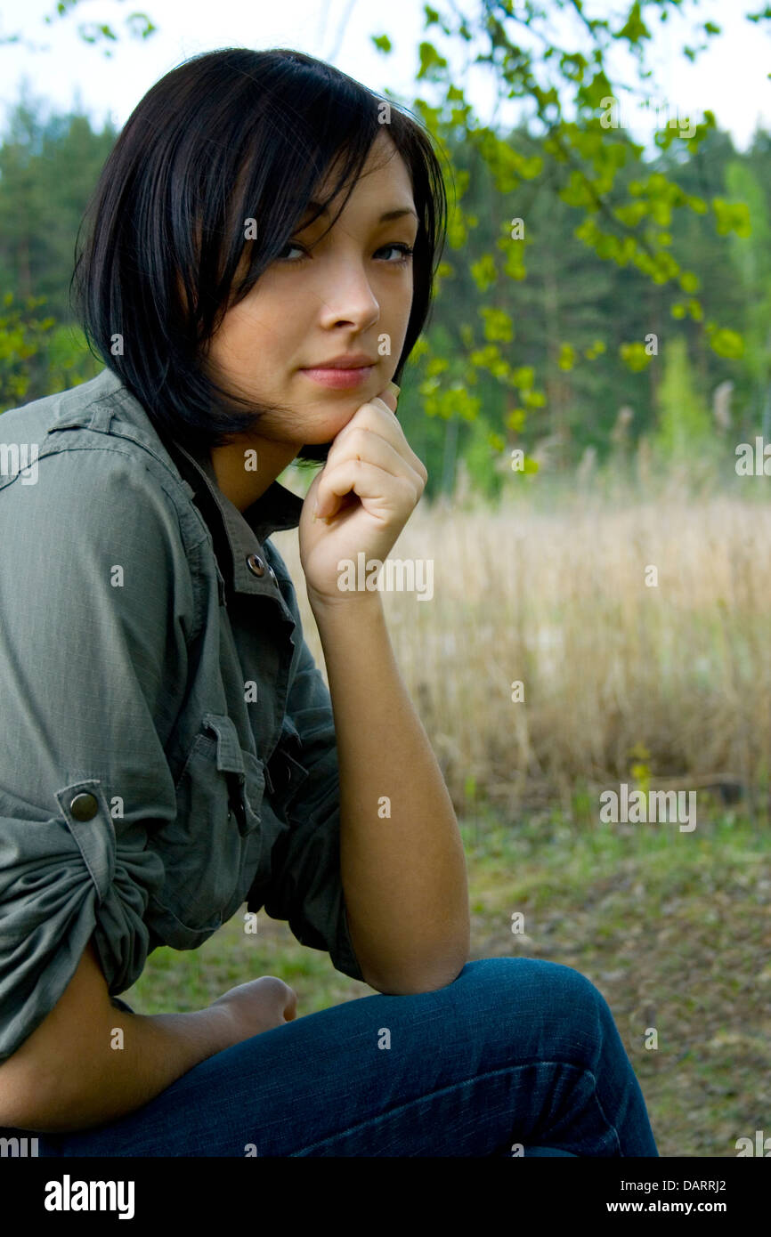 young sad woman in the forest Stock Photo - Alamy