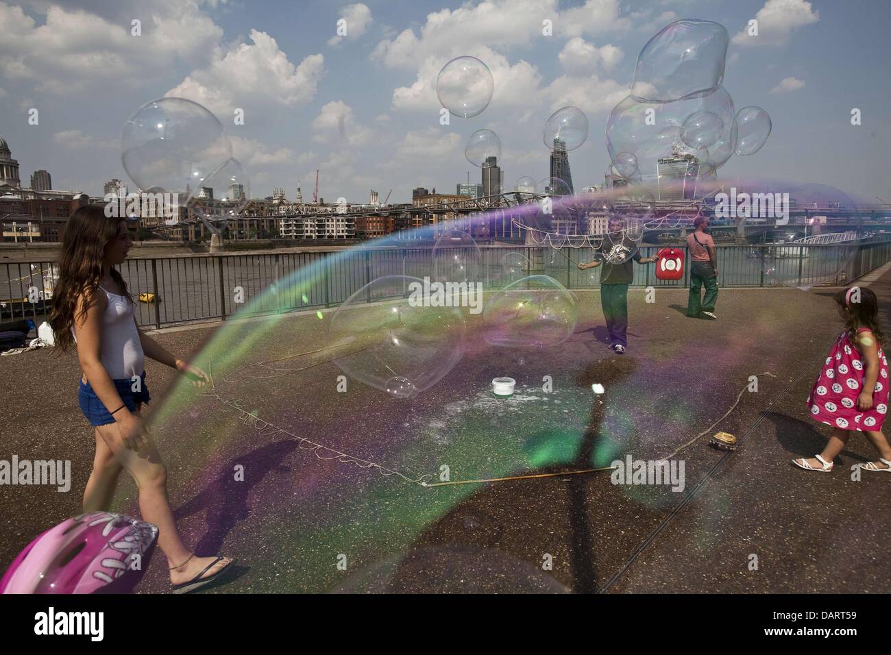 July 17, 2013 - London, UK - Massive bubbles are cheering up children ...