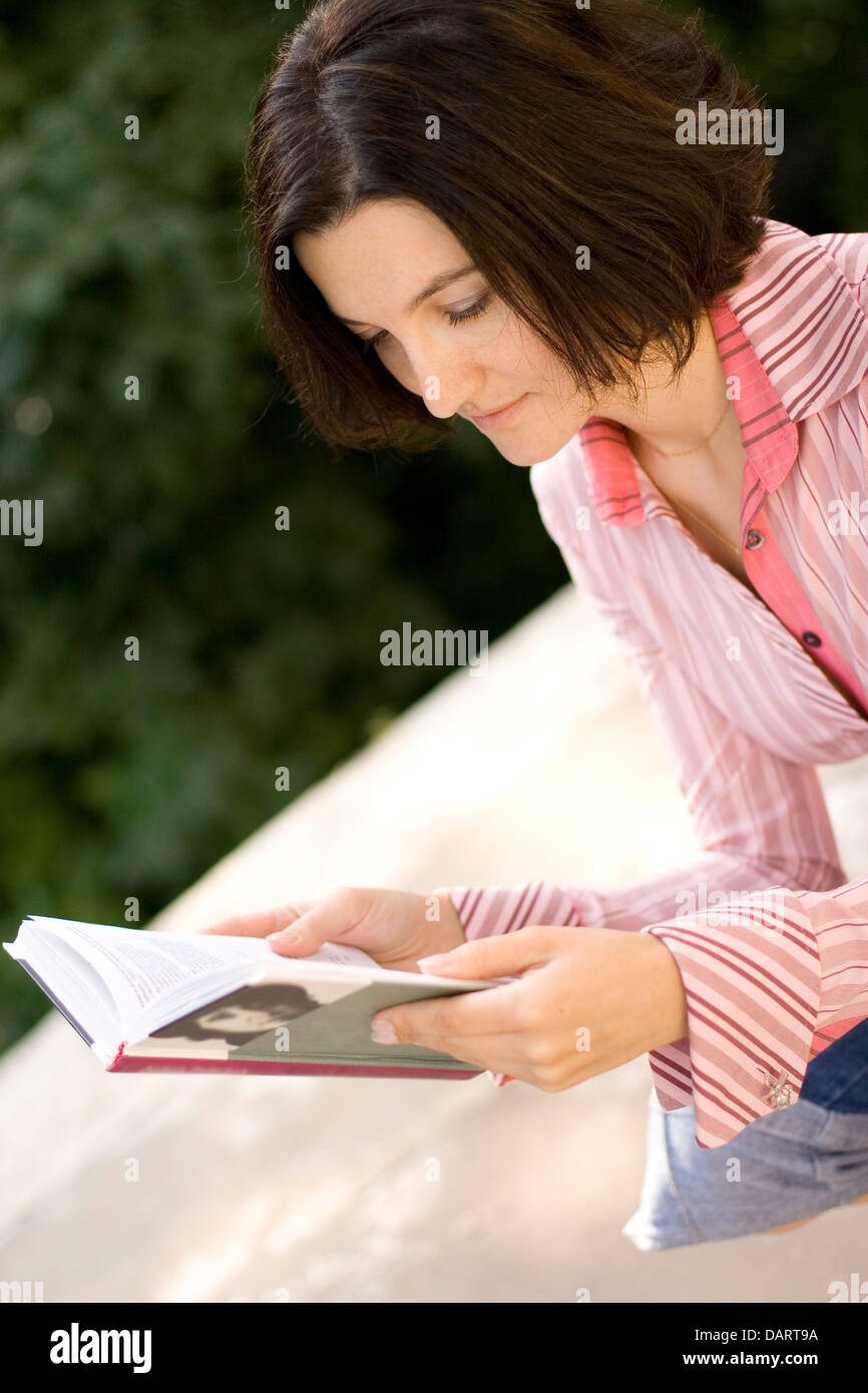 woman with book Stock Photo - Alamy