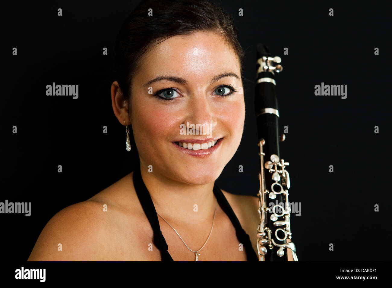 Cheerful clarinetist women Stock Photo - Alamy