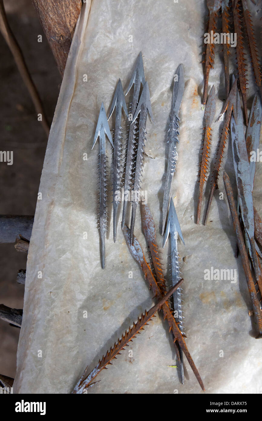 Africa, Tanzania. Men of the Datoga Tribe make razor-sharp arrowheads ...