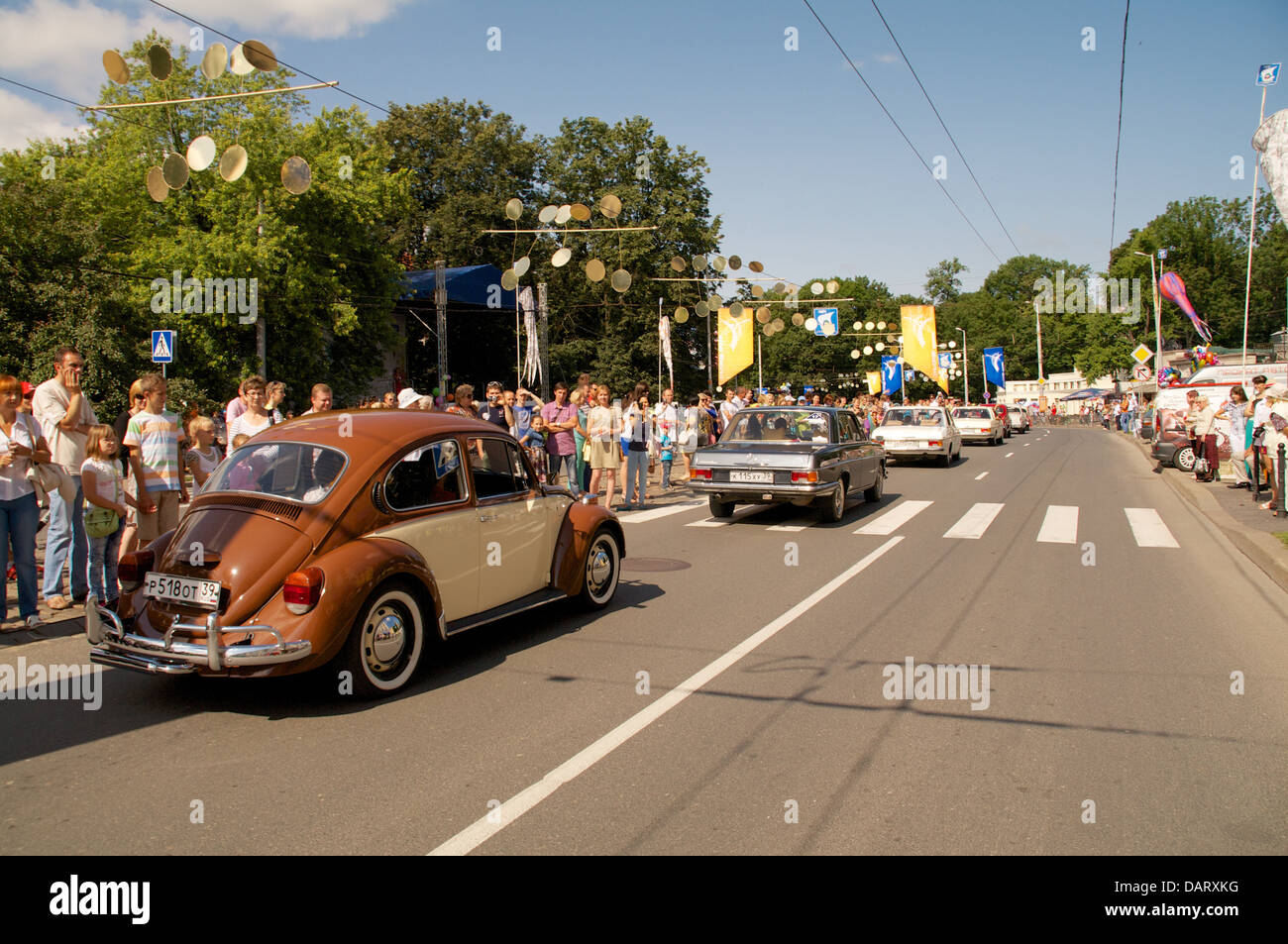 people and retro cars moves at street parade Stock Photo - Alamy