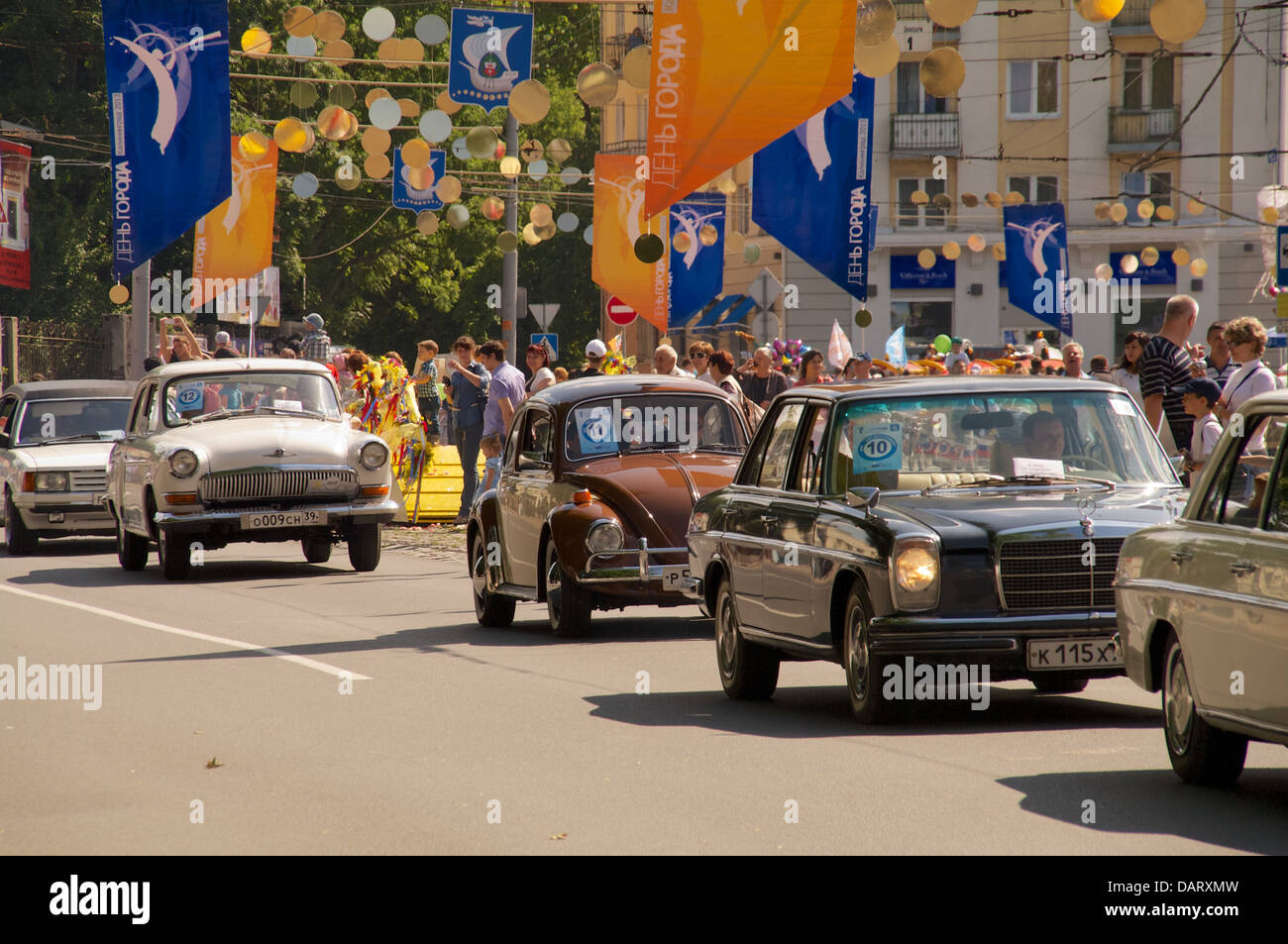 retro cars moves on street parade Stock Photo - Alamy