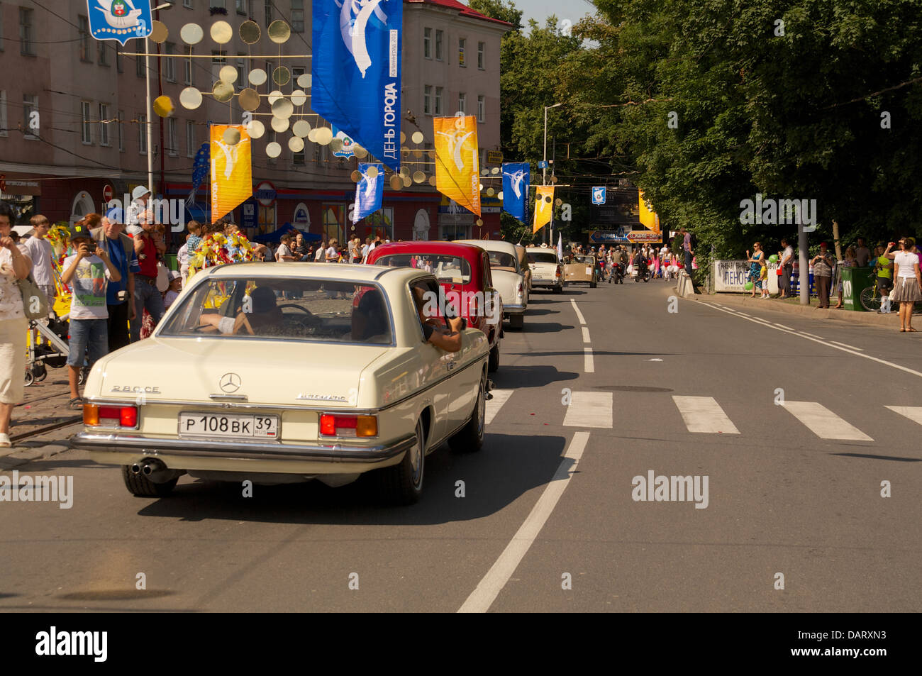 people and retro cars moves at street parade Stock Photo - Alamy