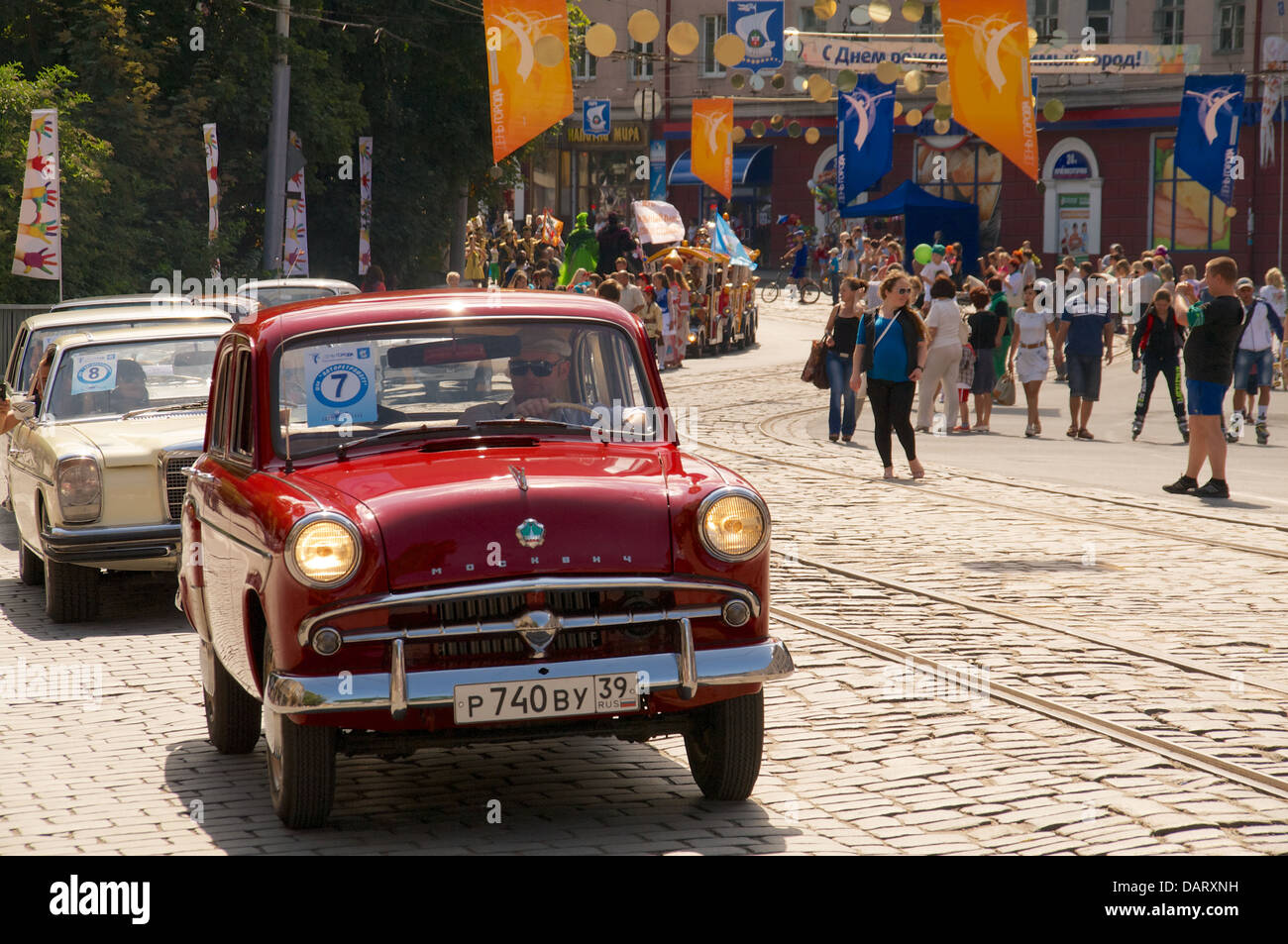 people and retro cars moves at street parade Stock Photo - Alamy