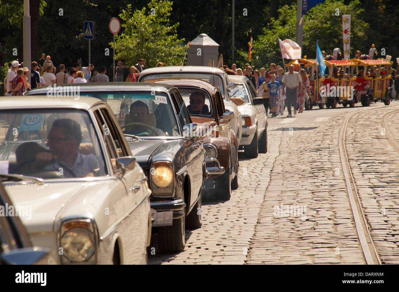 people and retro cars walks on street parade Stock Photo - Alamy