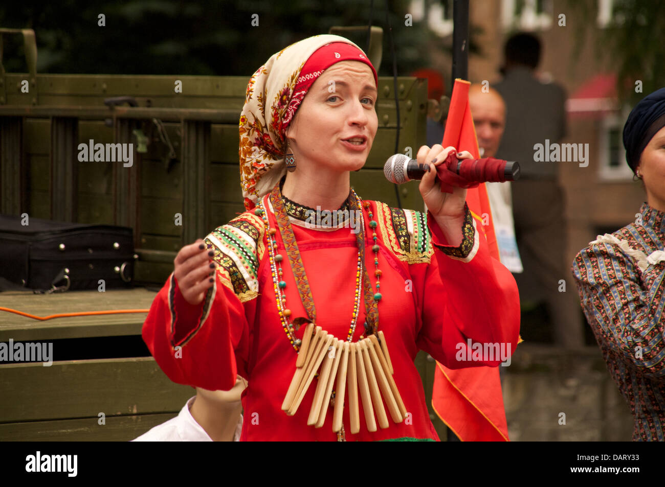 woman in russian national dress sang on the street on City Day ...