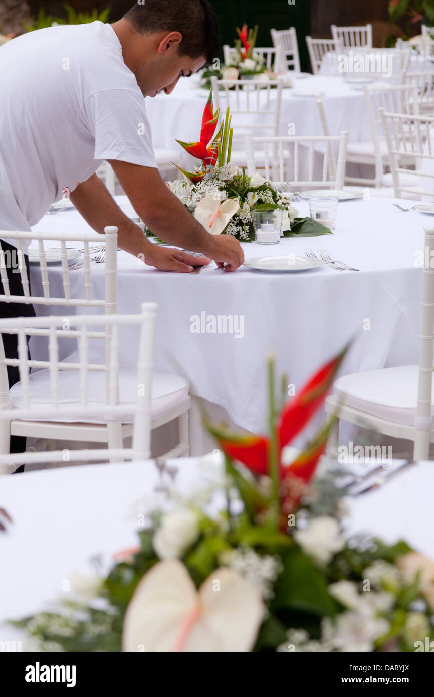 A waiter prepares a table setting Stock Photo - Alamy