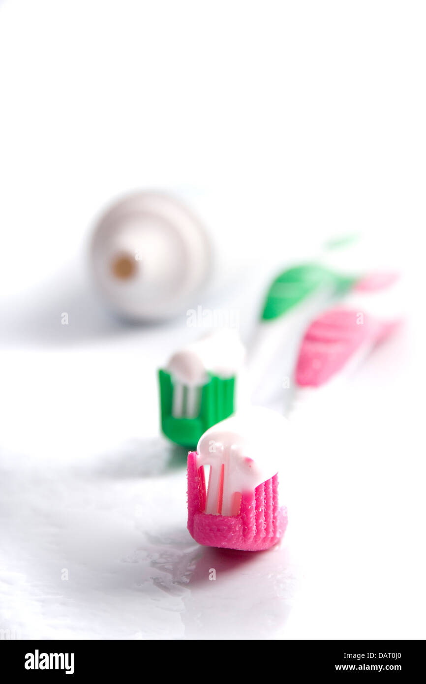 toothpaste and toothbrushes Stock Photo - Alamy