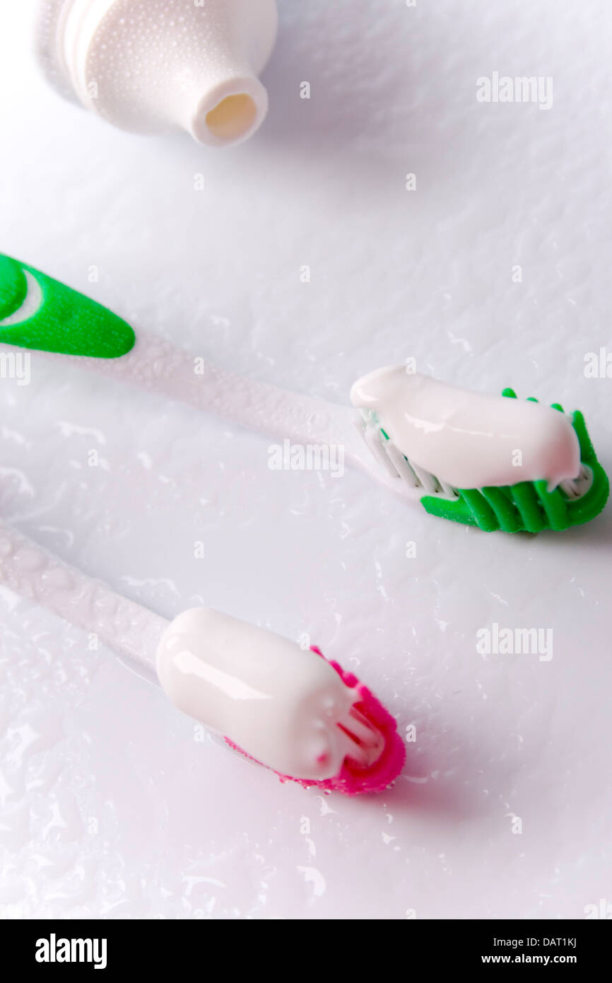 toothpaste and toothbrushes Stock Photo - Alamy