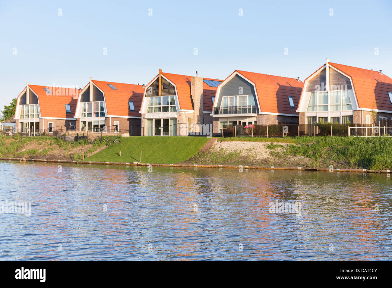 Small houses along a Dutch channel Stock Photo - Alamy