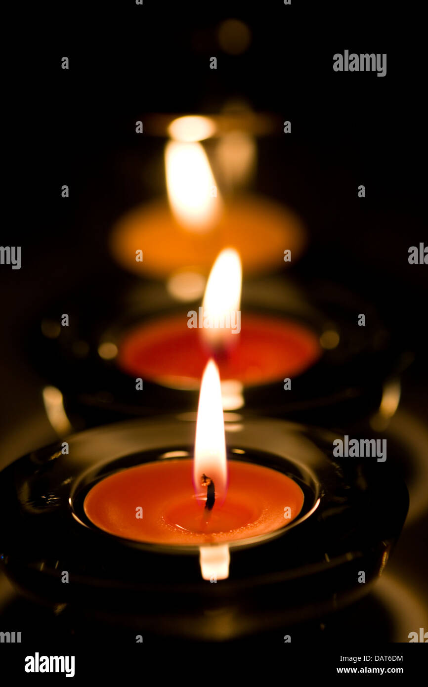 three candles flaming Stock Photo - Alamy
