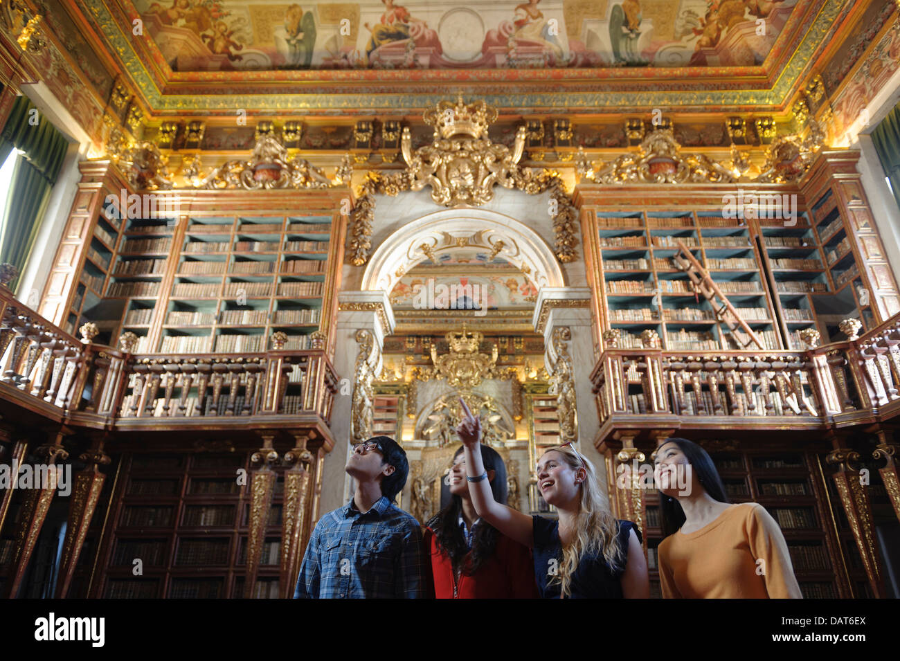 People visiting Coimbra University's 18th century baroque library ...