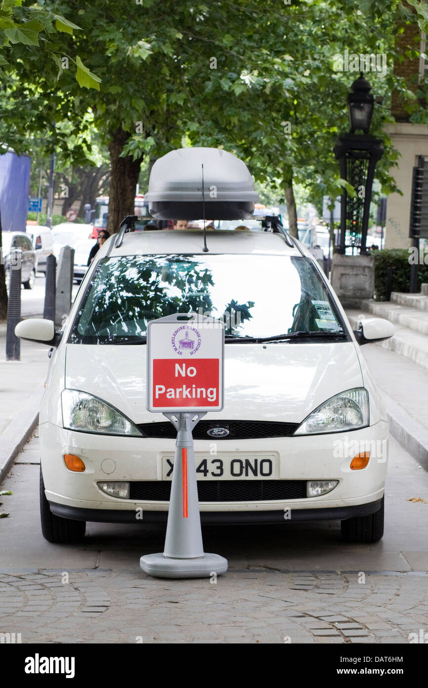 car parked in a no parking zone Stock Photo - Alamy