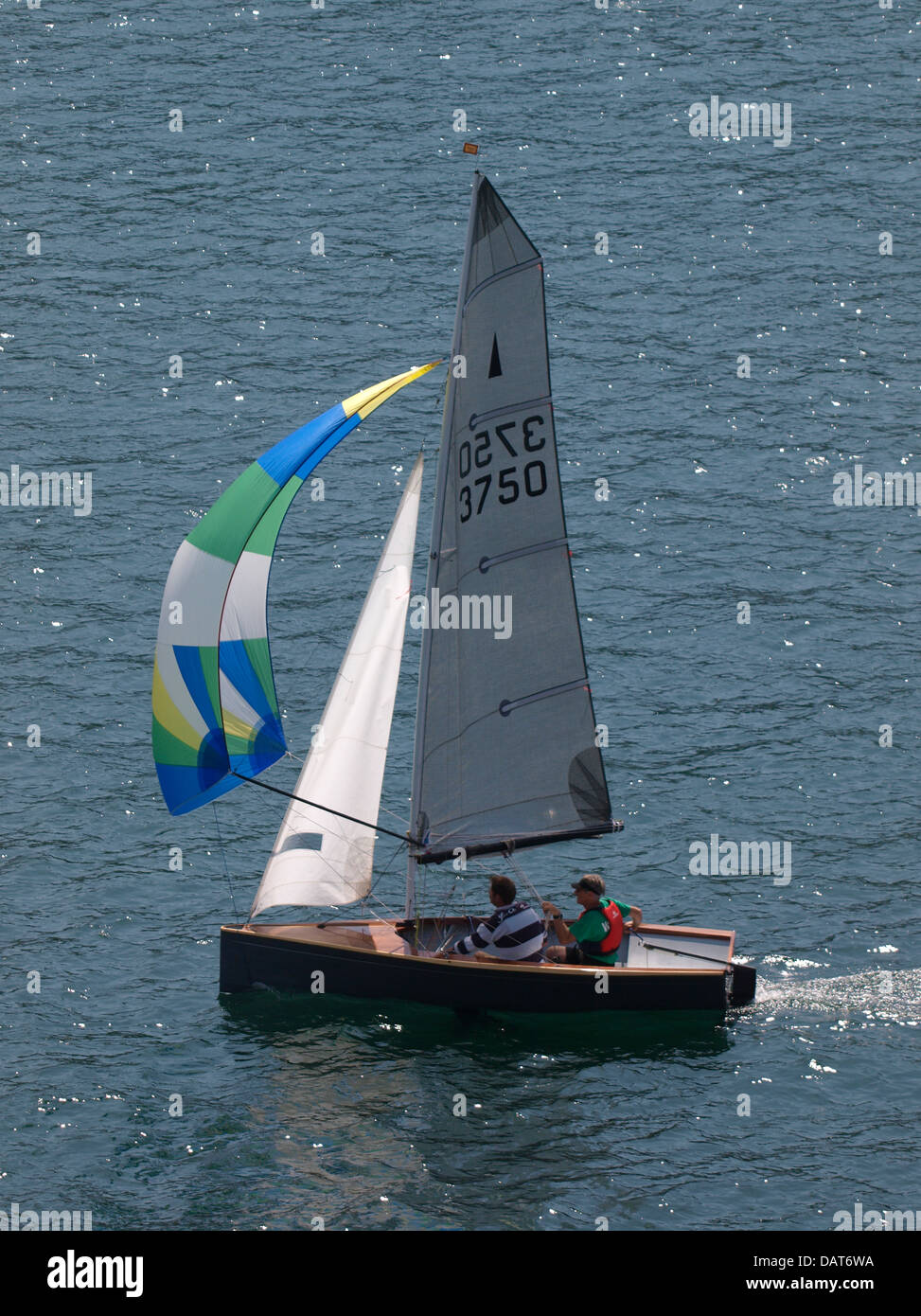 Small sail boat with spinnaker, Devon, UK 2013 Stock Photo - Alamy