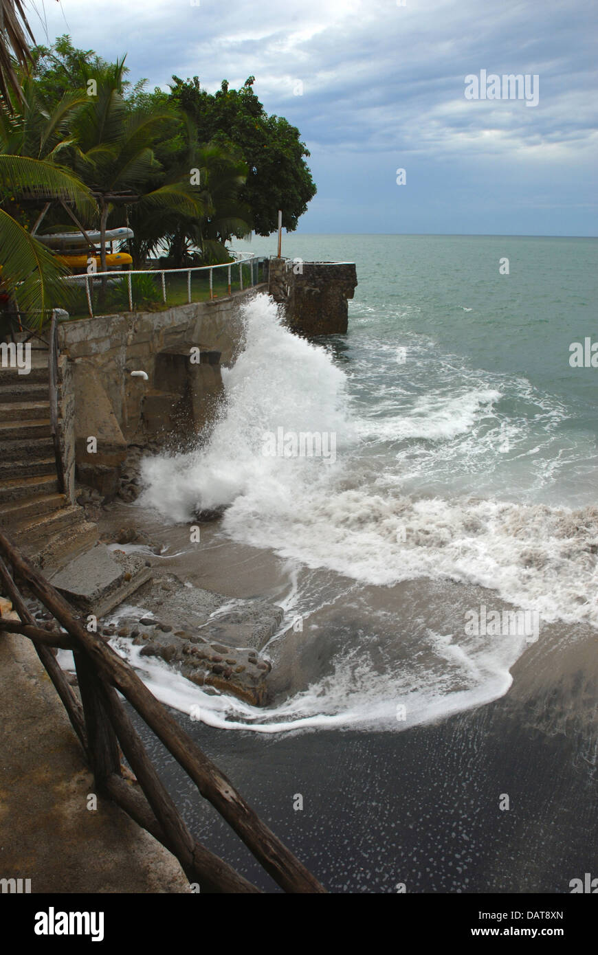 Wave breaking on the walkway of the cliff Stock Photo - Alamy