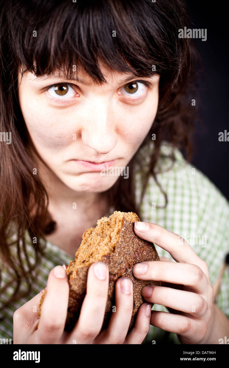 beggar with a piece of bread Stock Photo - Alamy