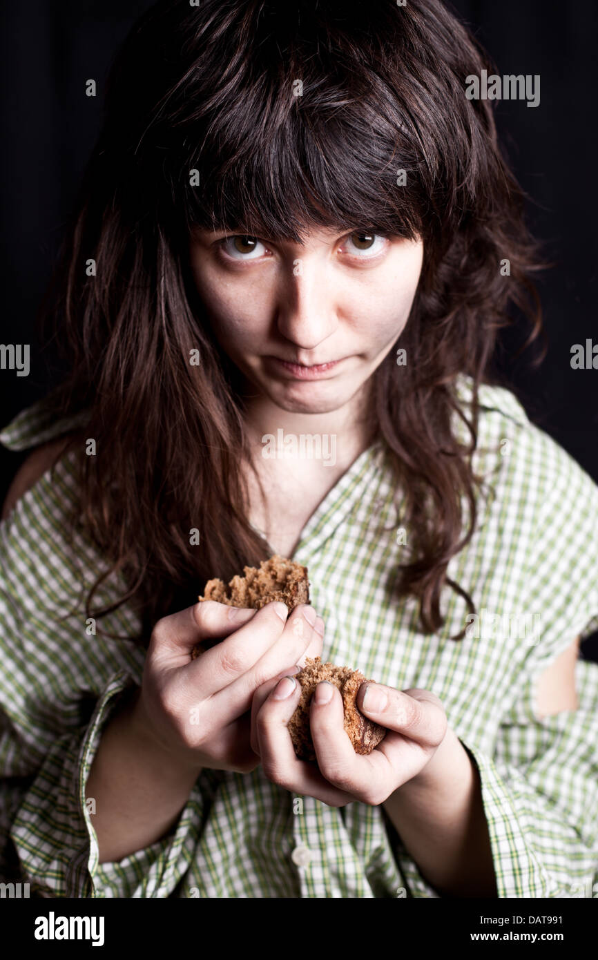 beggar with a piece of bread Stock Photo - Alamy