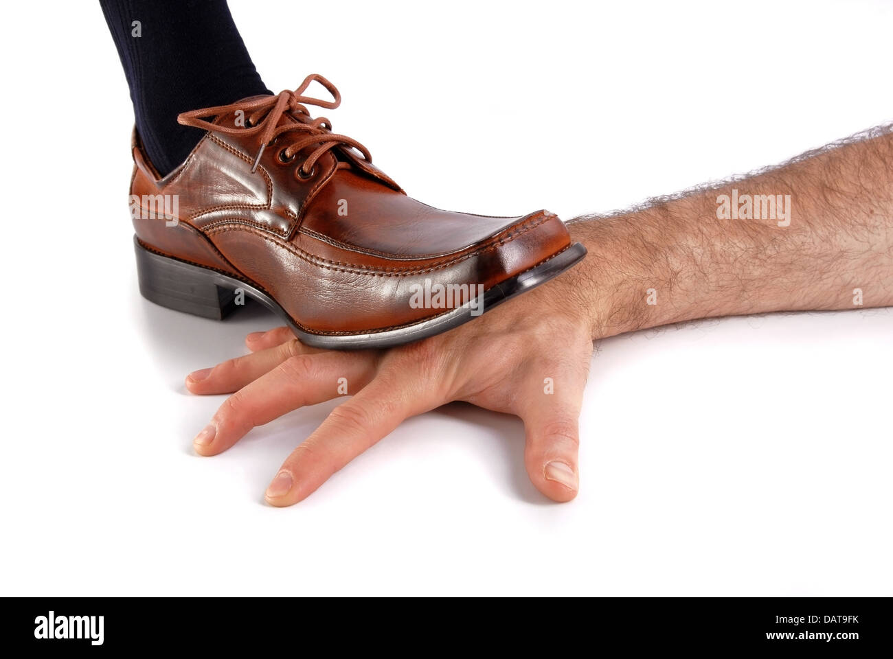 Foot stepping on a hand Stock Photo - Alamy