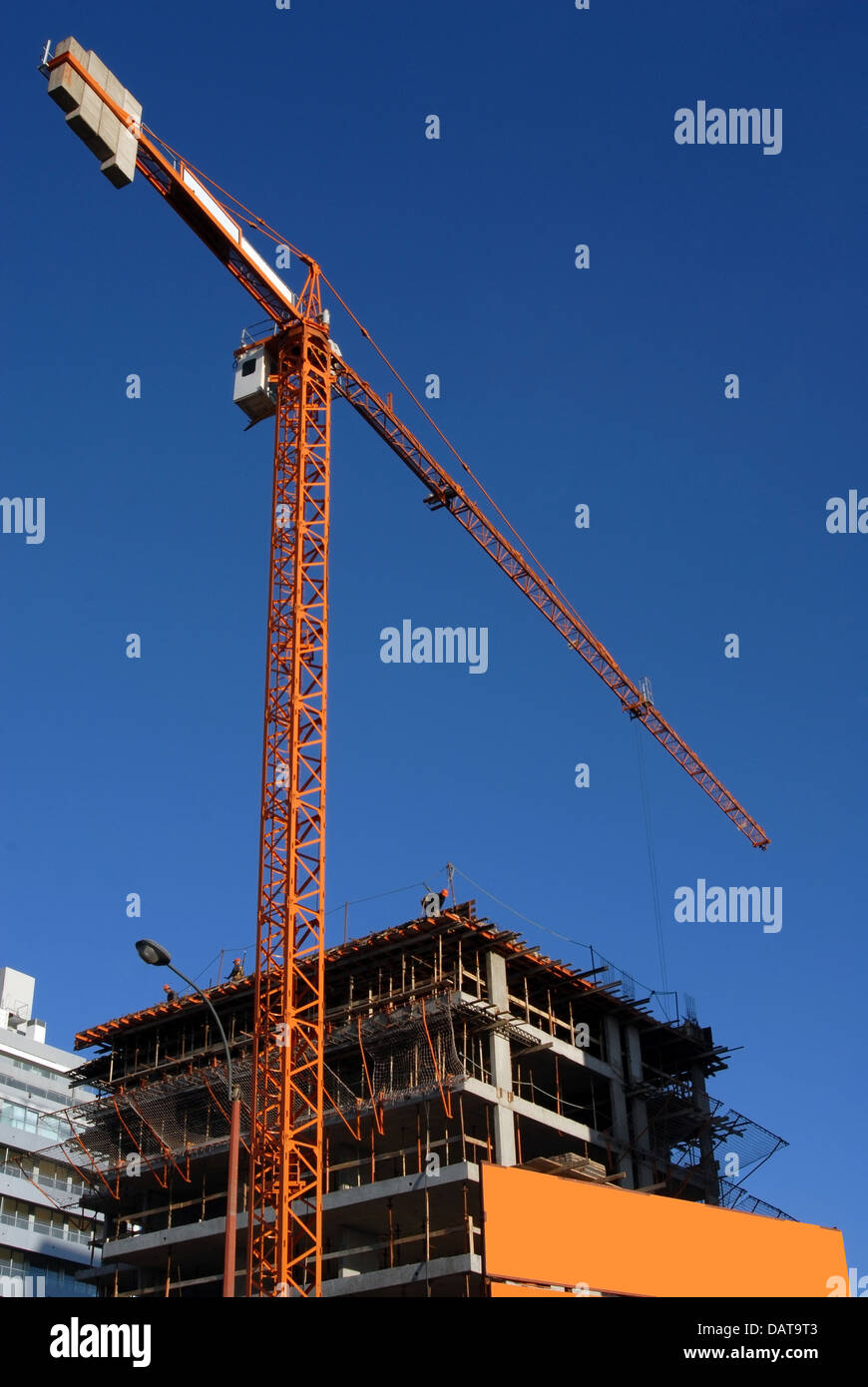 Crane at a building construction Stock Photo - Alamy